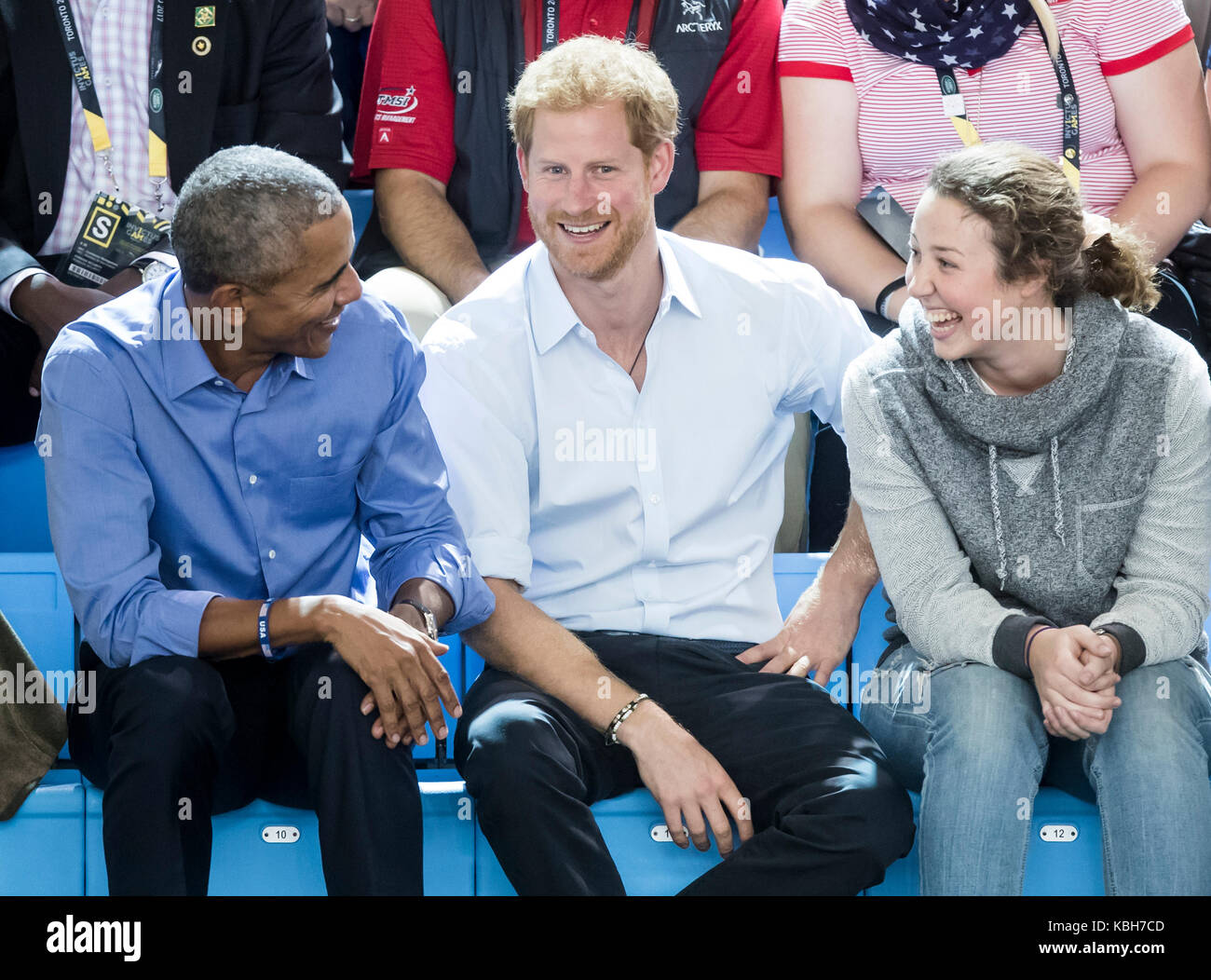 Barack Obama and Prince Harry are pictured with spectator Hayley Stover ...