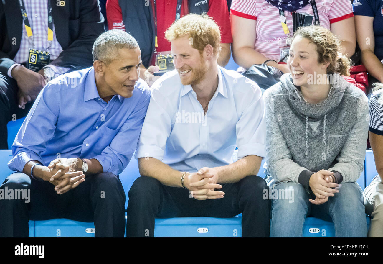 Barack Obama and Prince Harry are pictured with spectator Hayley Stover ...