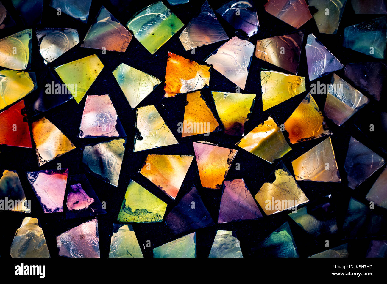 Pieces of colorful glass in dark mortar Stock Photo - Alamy