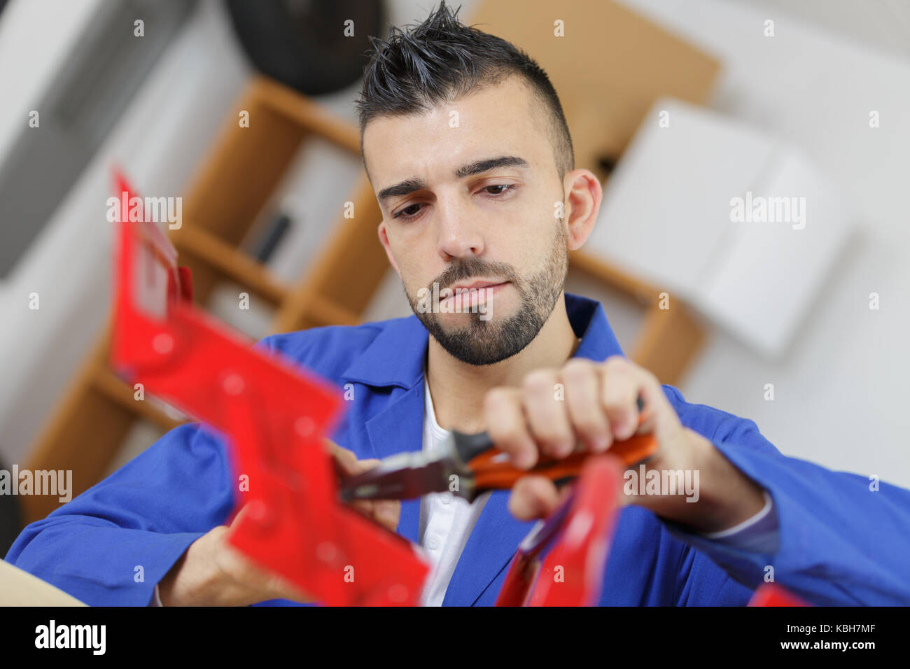 handyman searching in his tool box for the necessary tools Stock Photo ...