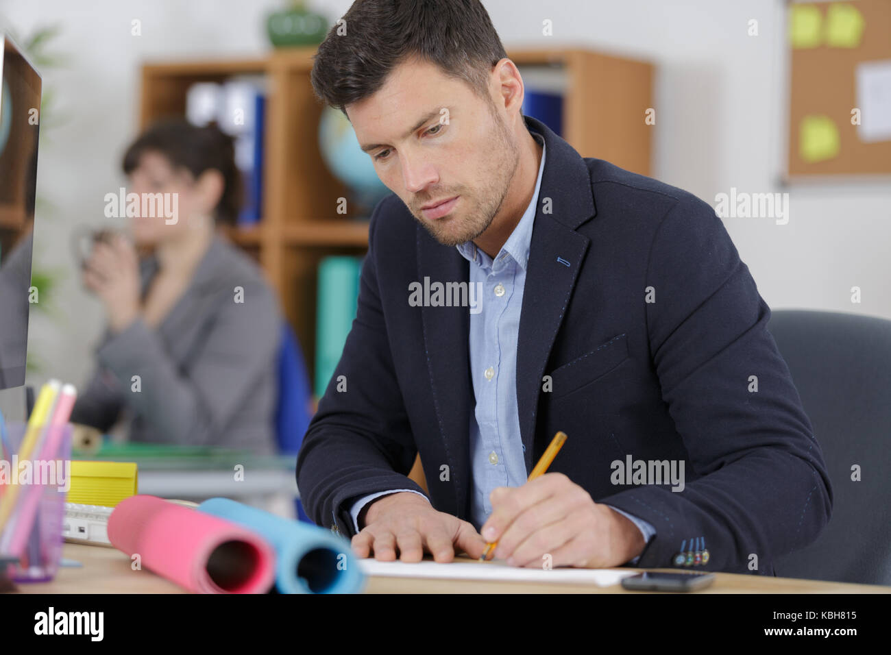 male worker drawing the concept Stock Photo - Alamy