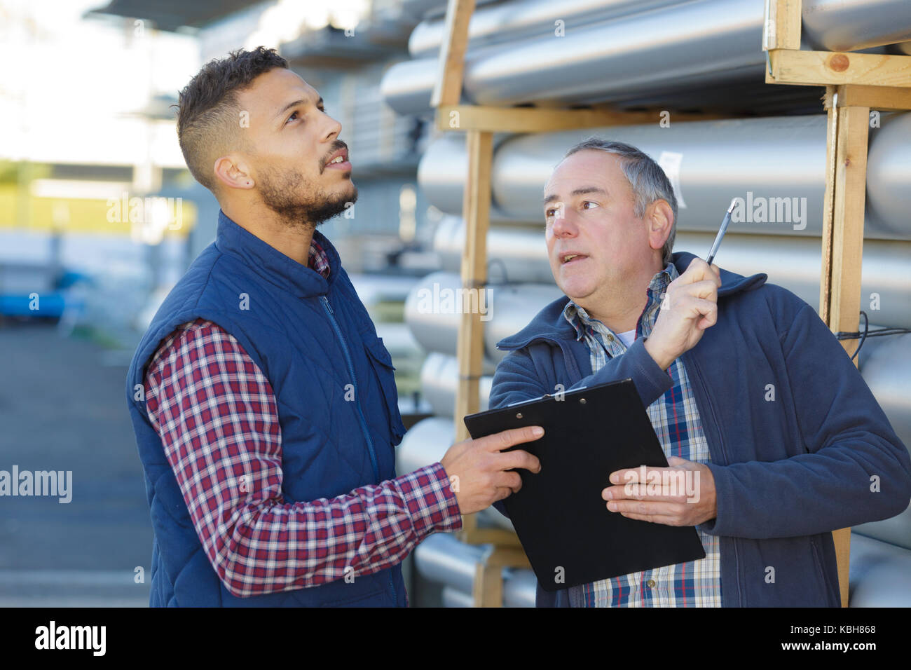 worker giving the record to the colleague Stock Photo - Alamy