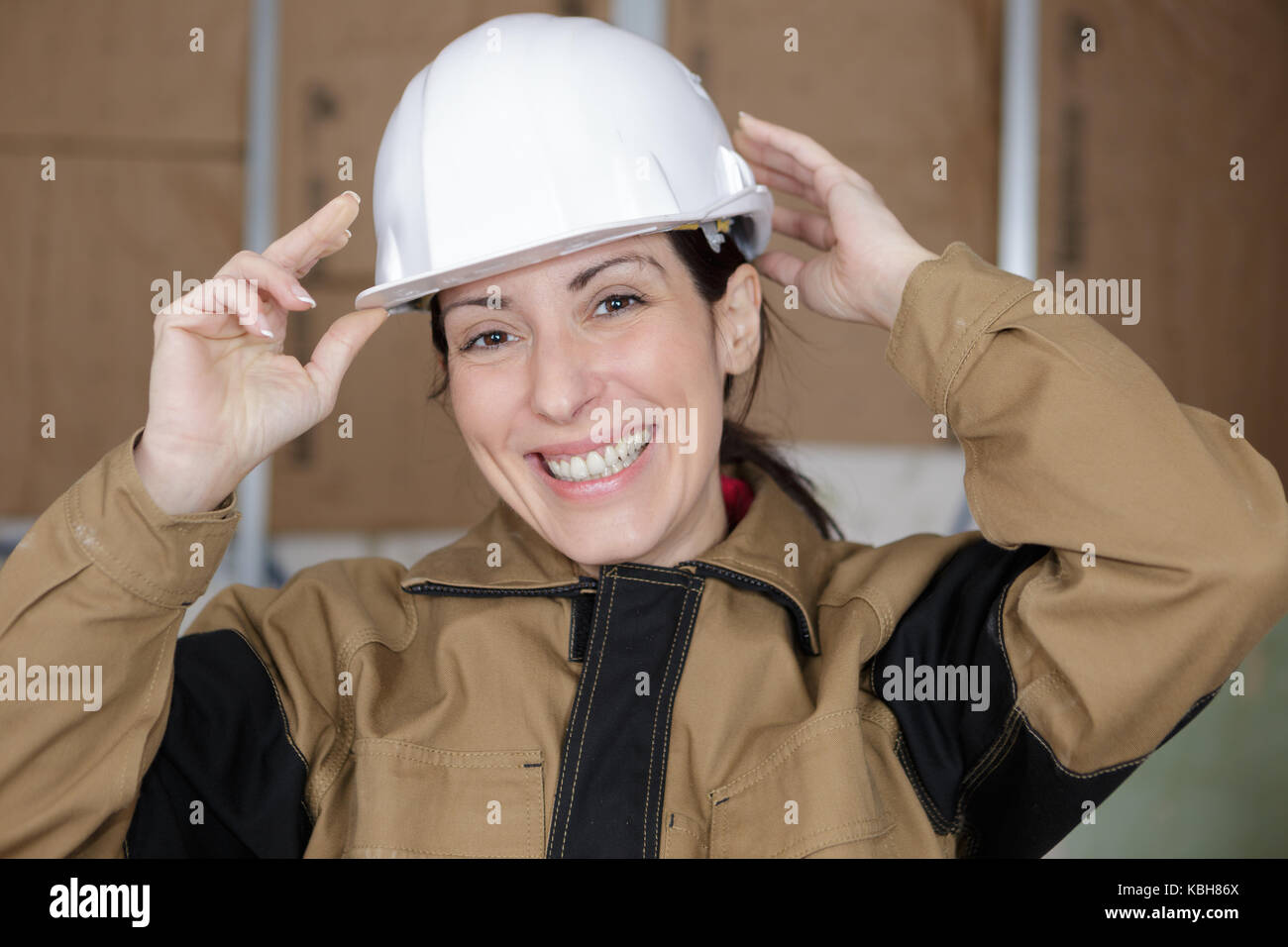 female worker with hard hat smiling Stock Photo - Alamy