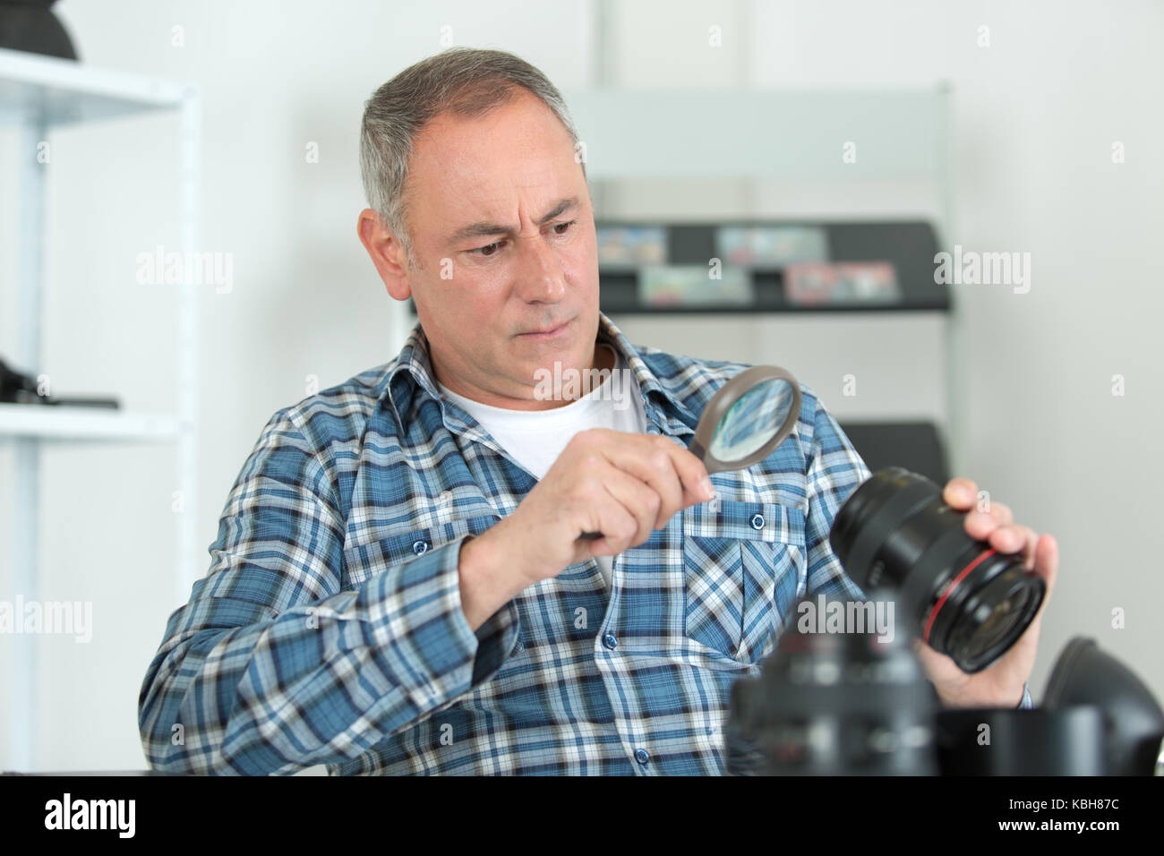 inspecting the camera lens Stock Photo - Alamy