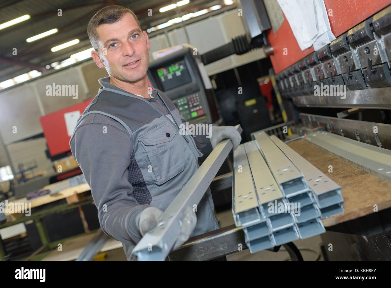 man holding a steel frame Stock Photo - Alamy