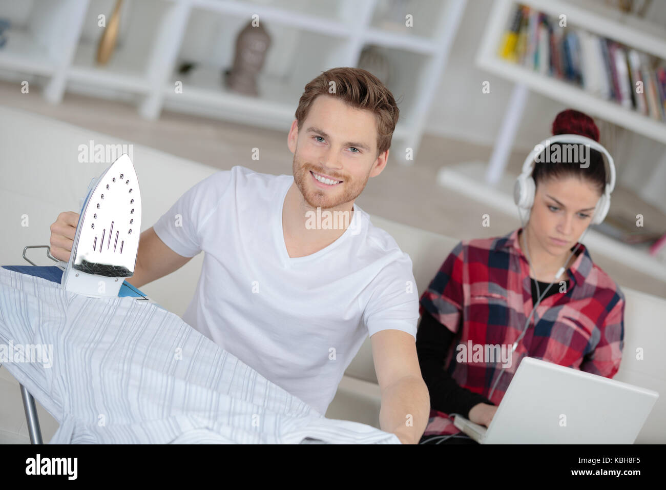 man holding an iron Stock Photo - Alamy