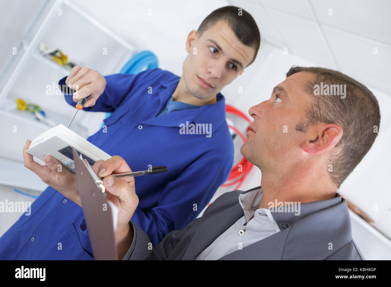 conversation with the apprentice Stock Photo - Alamy