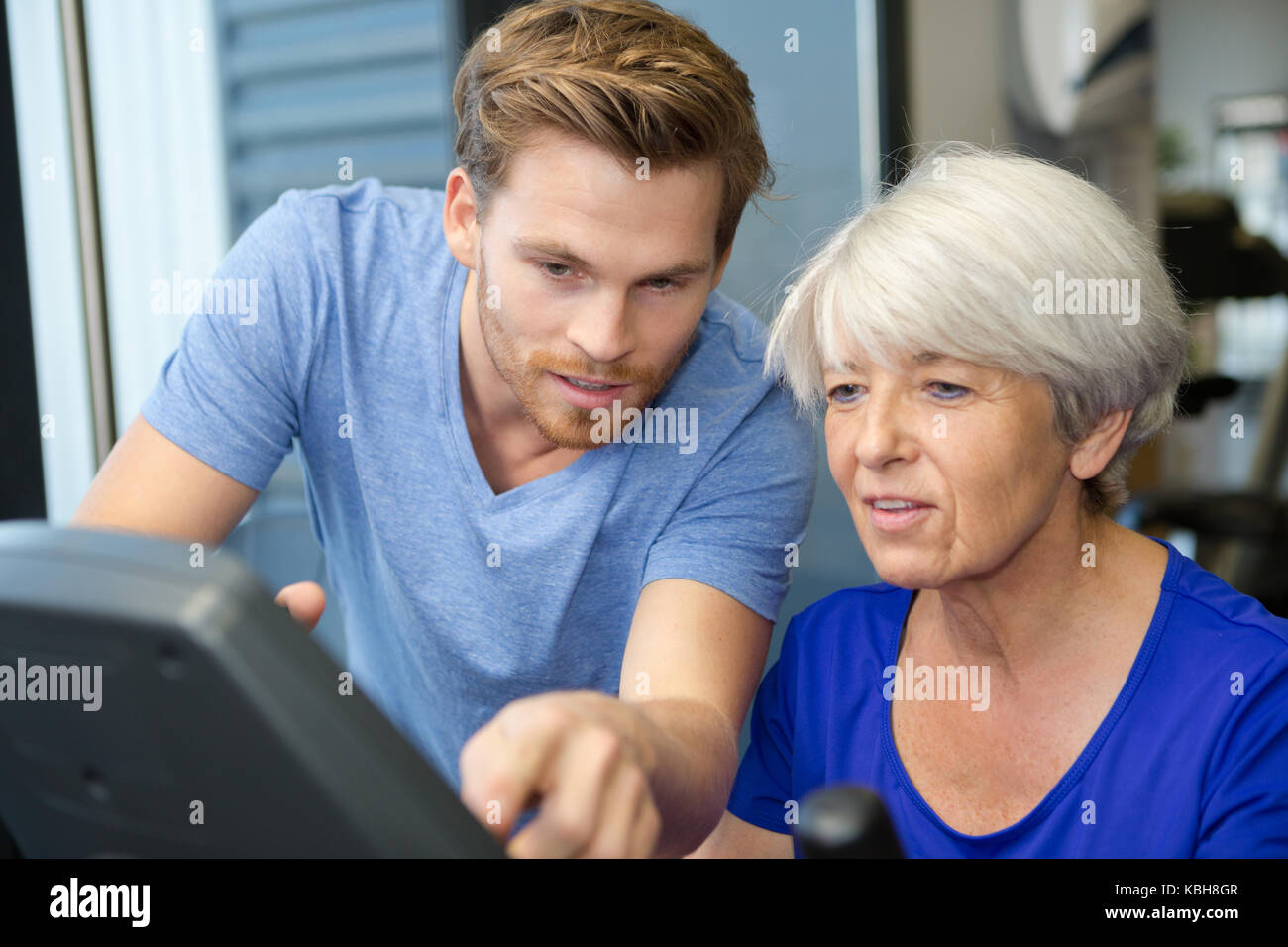 learning a new trainer in the gym Stock Photo - Alamy