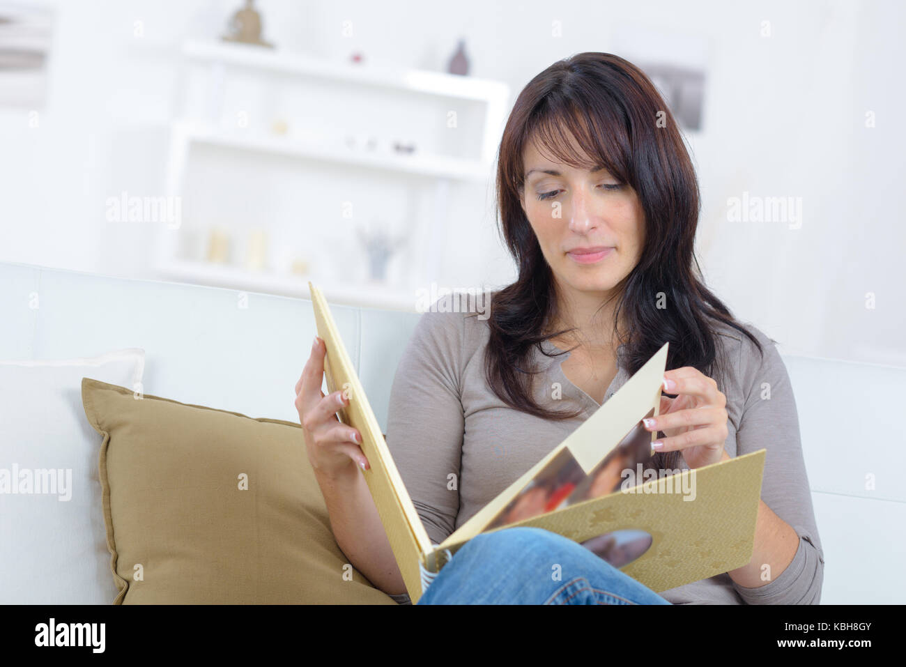 browsing the photo album Stock Photo - Alamy