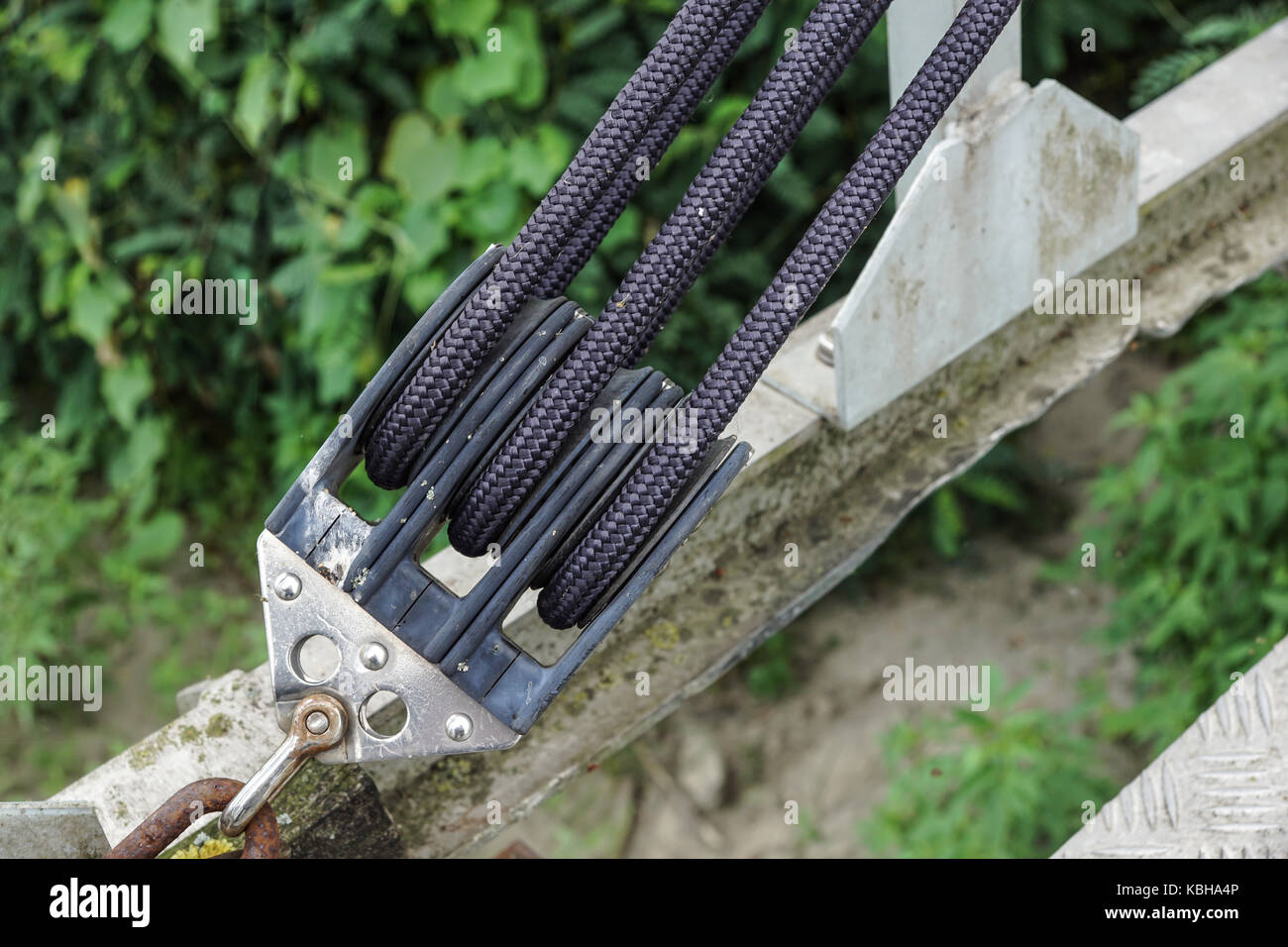 big Pulley and rope on forest background Stock Photo - Alamy
