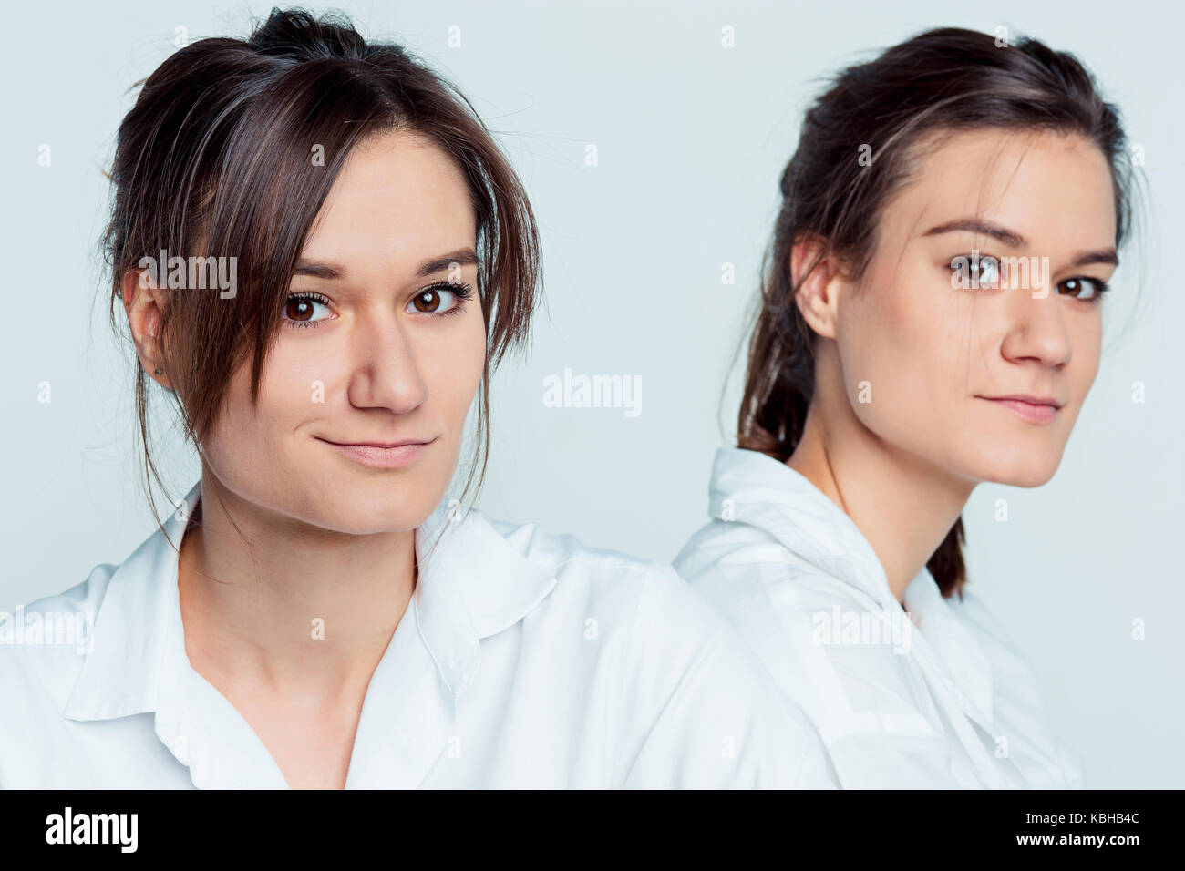 Studio portrait of female twins Stock Photo - Alamy