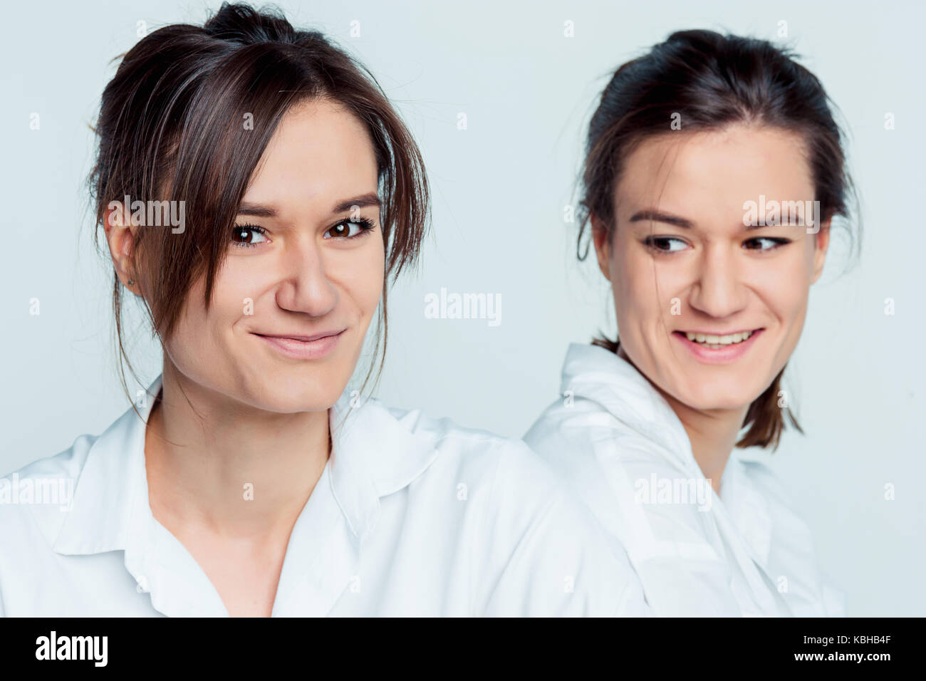 Studio portrait of female twins Stock Photo - Alamy