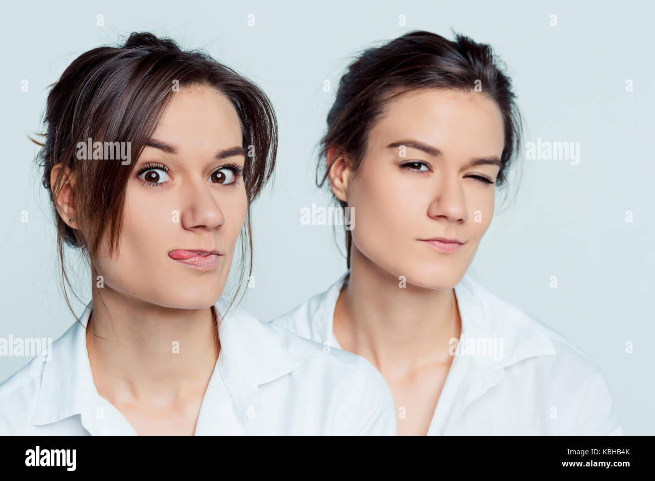 Studio portrait of female twins Stock Photo - Alamy