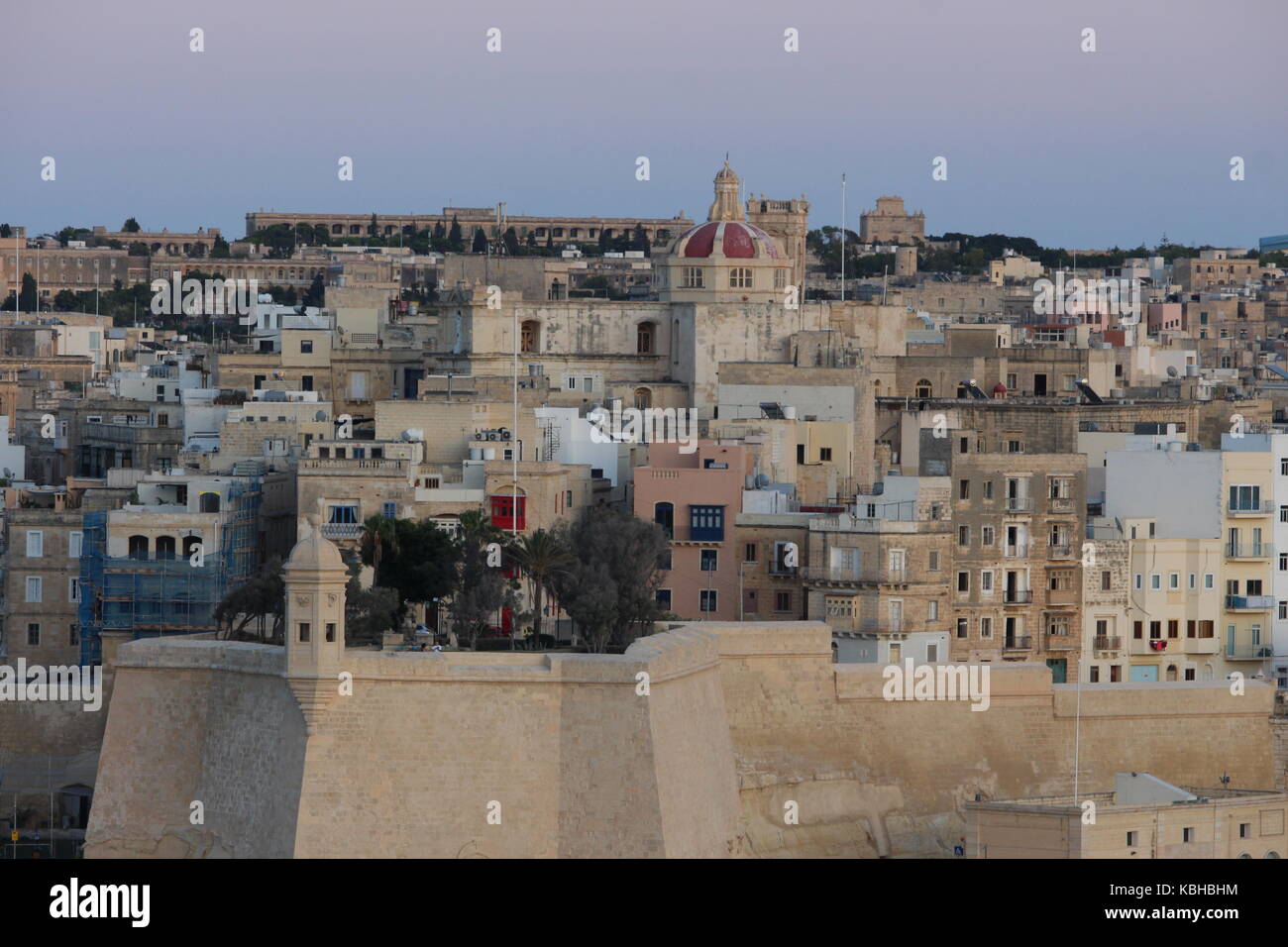 A cityscape view of La Guardiola and St Phillip's Church, evening ...