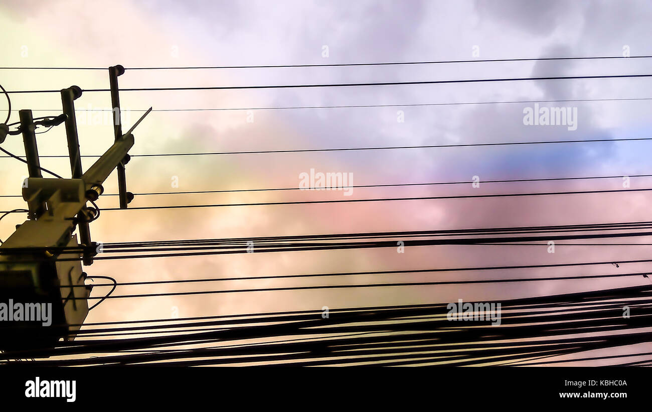 power electric lines and colorfull fantacy sky Stock Photo - Alamy