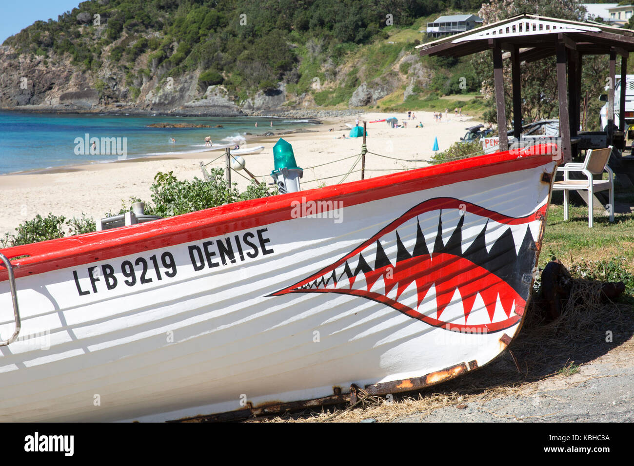 Timber boat with painted hull on Boat Beach at Seal Rocks seaside area ...