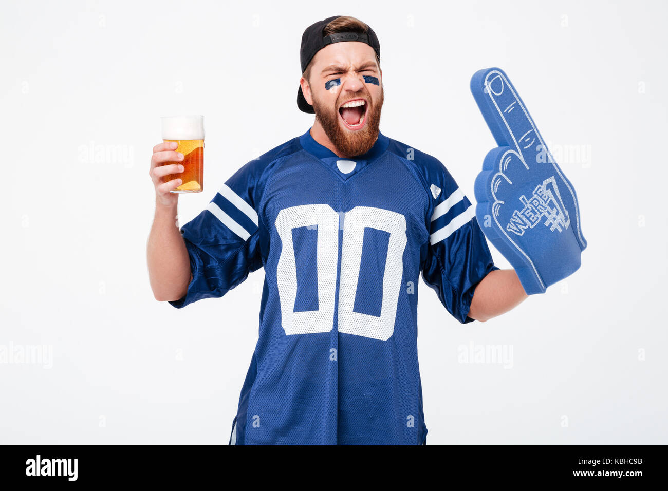 Image of handsome man fan in blue t-shirt wearing fan finger number one ...