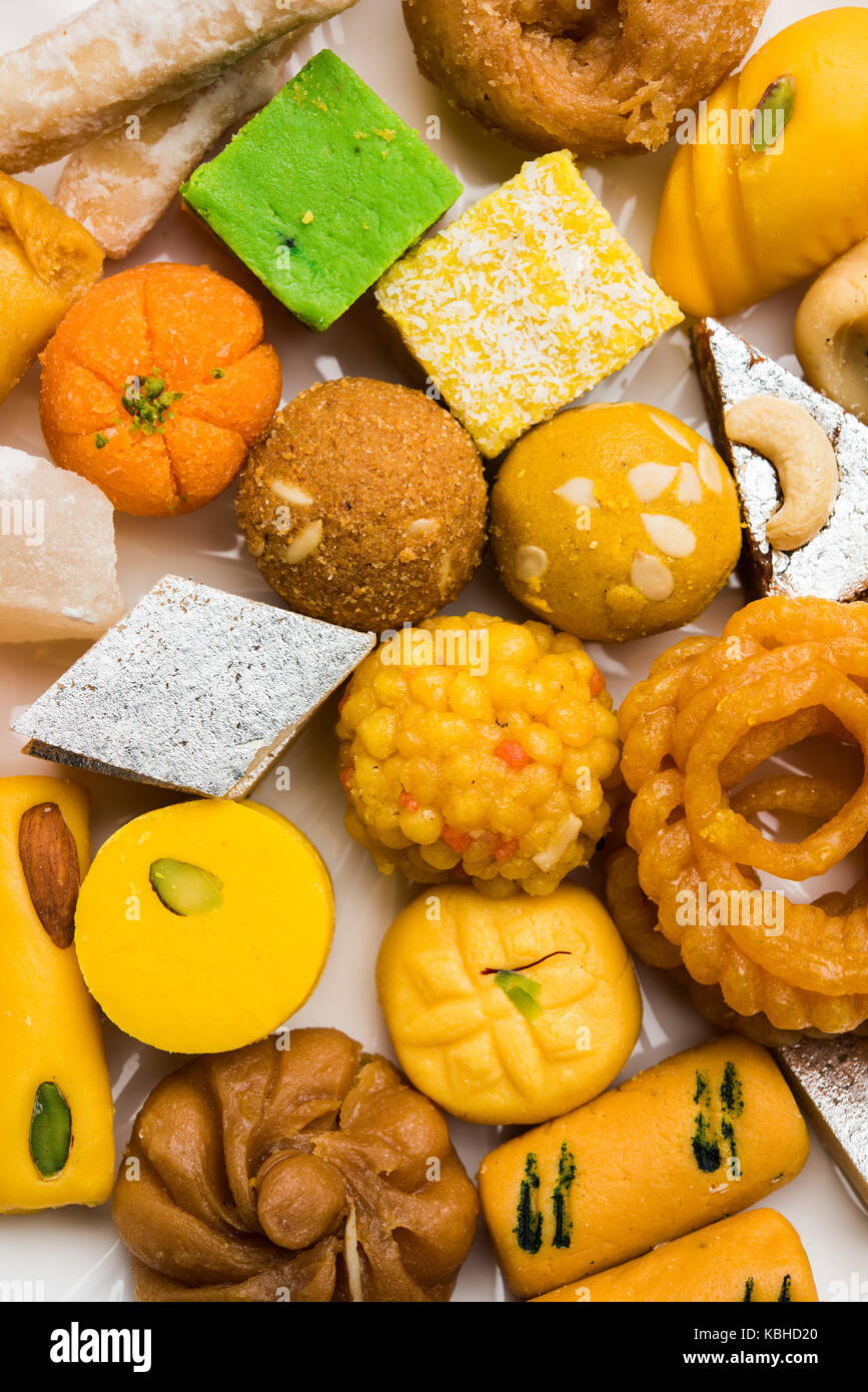 stock photo of Indian sweet or mithai and oil lamps or diya with ...