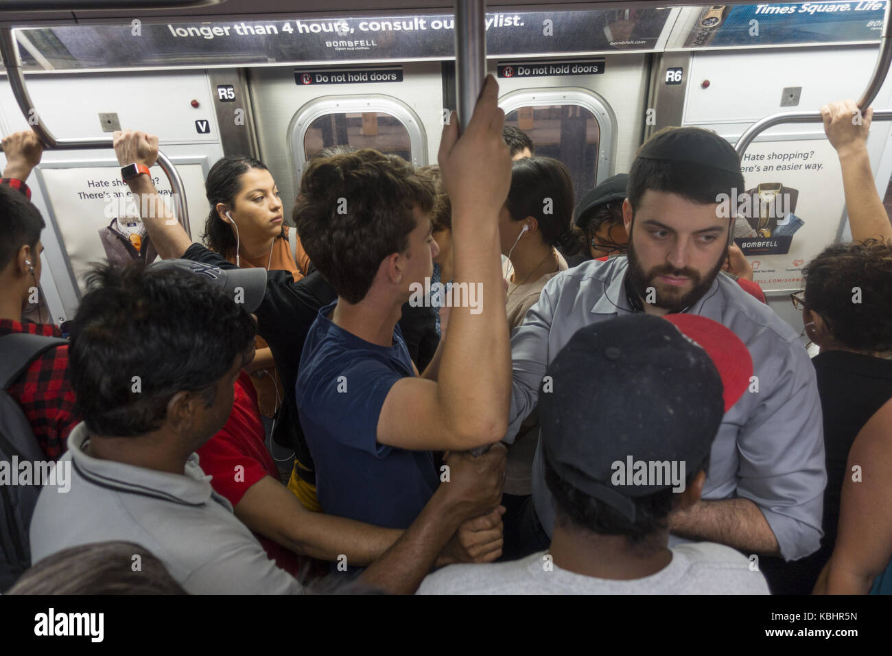 Very crowded F train on its way from Brooklyn to Manhattan during the ...