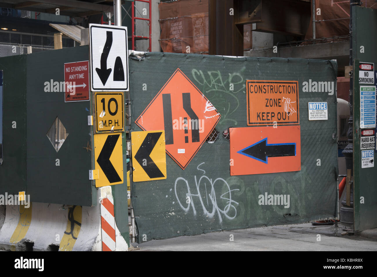 Signs on the wall at the sidewalk on a building construction site in ...