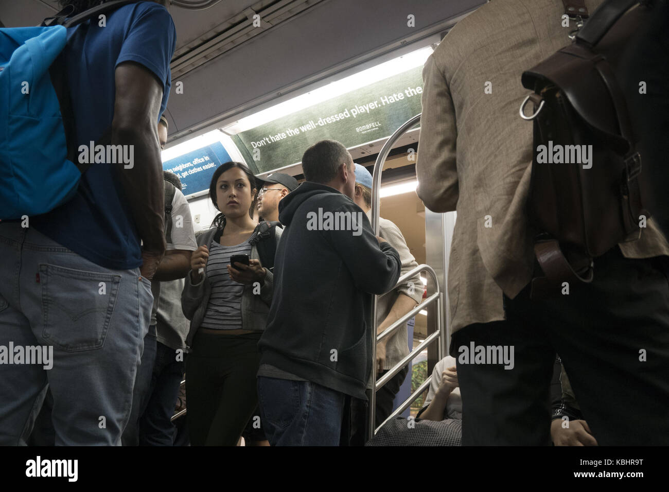 Crowded subway train car in in New York City Stock Photo - Alamy