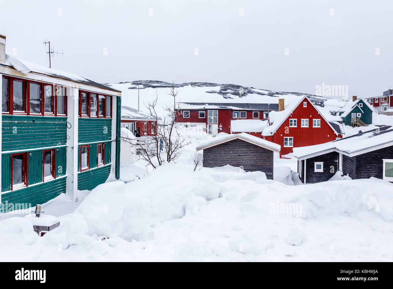 Greenlandic Inuit houses among covered in snow a suburb of arctic ...