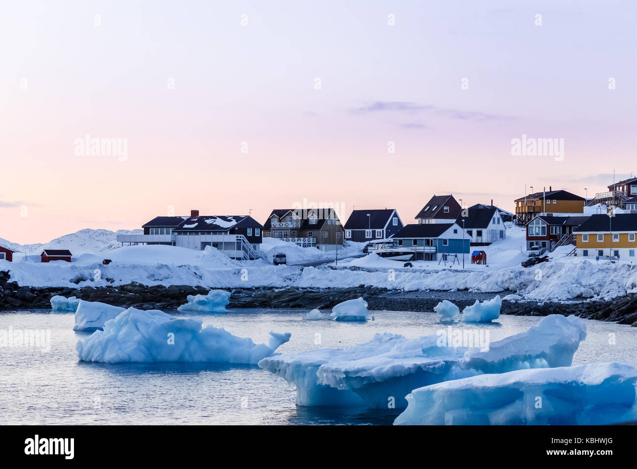 Nuuk city old harbor sunset view with icebergs, Greenland Stock Photo ...