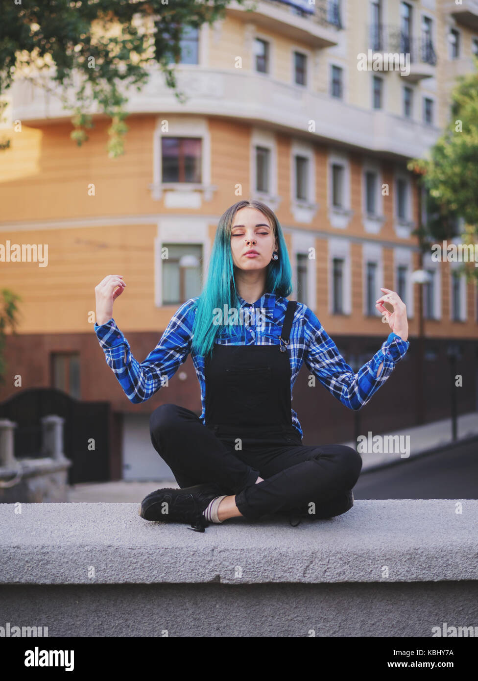 Calm street punk or hipster girl with blue dyed hair. Woman with ...