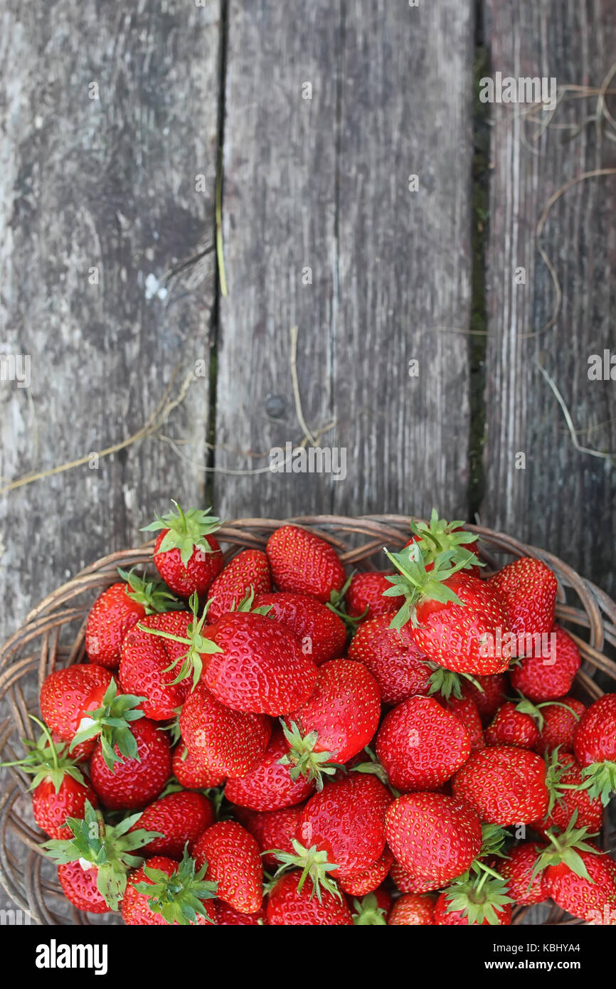 Strawberry on rustic wooden background Stock Photo - Alamy