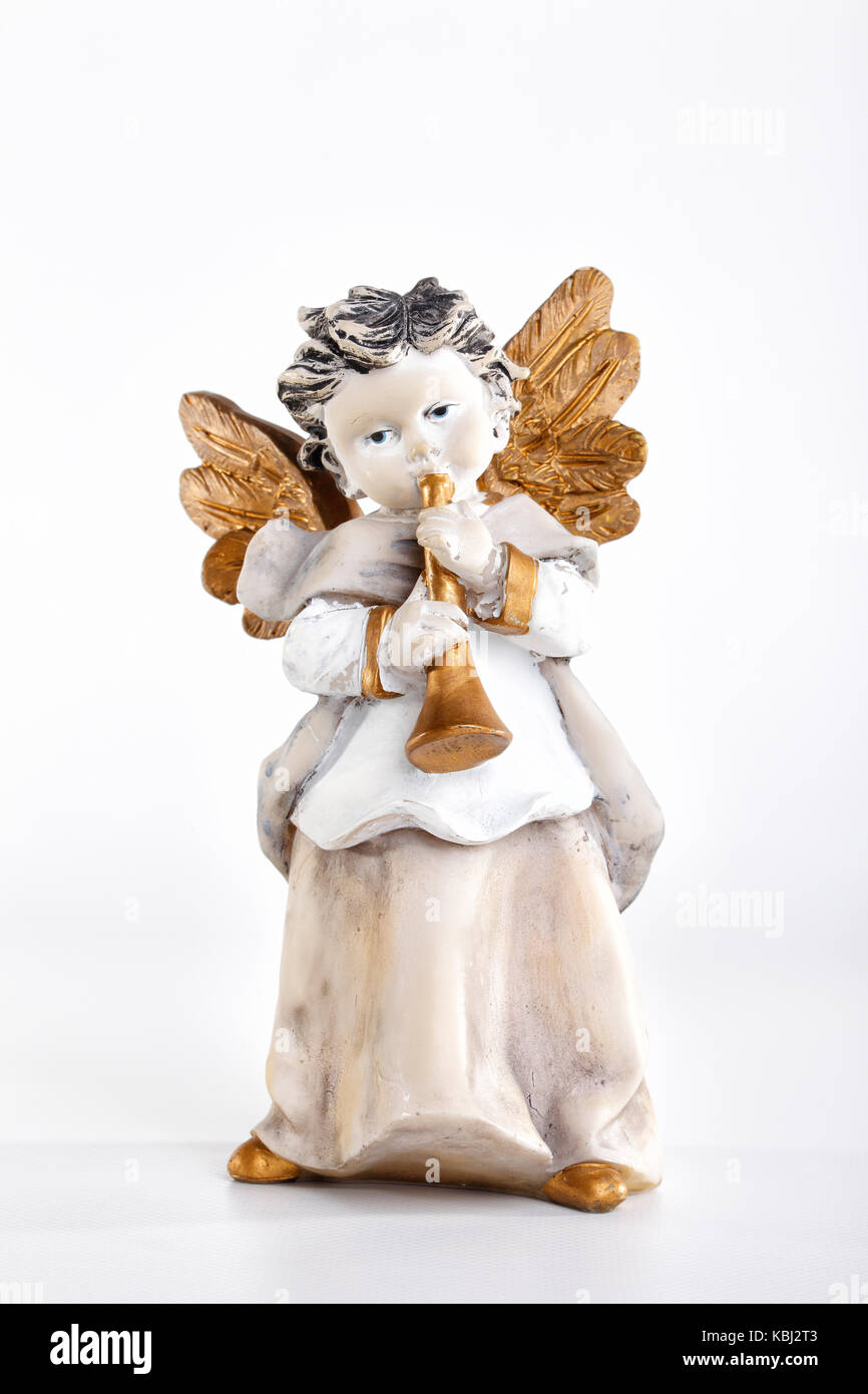 Figure of angel playing trumpet Stock Photo - Alamy