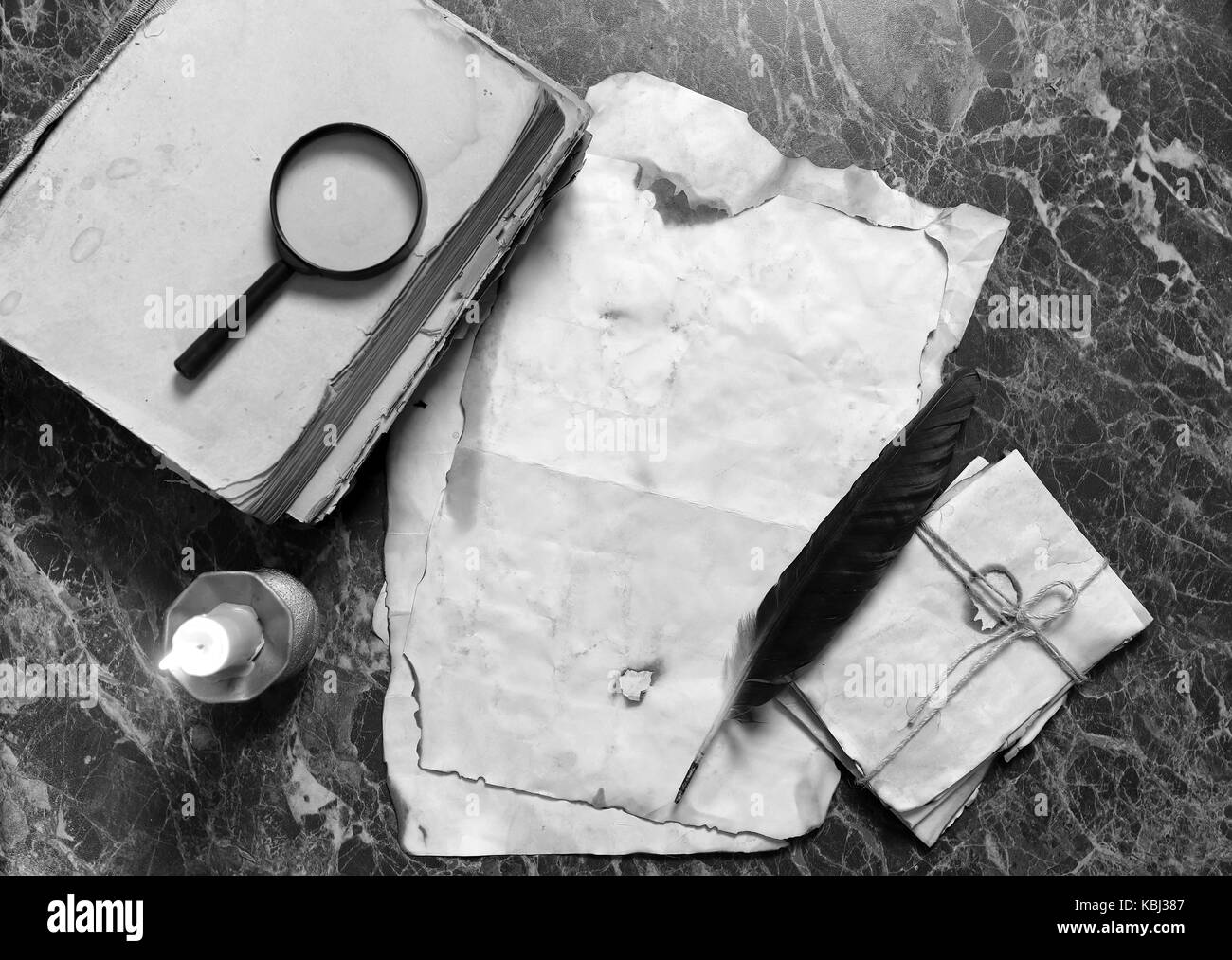 papers and book on detective work table with tools Stock Photo - Alamy