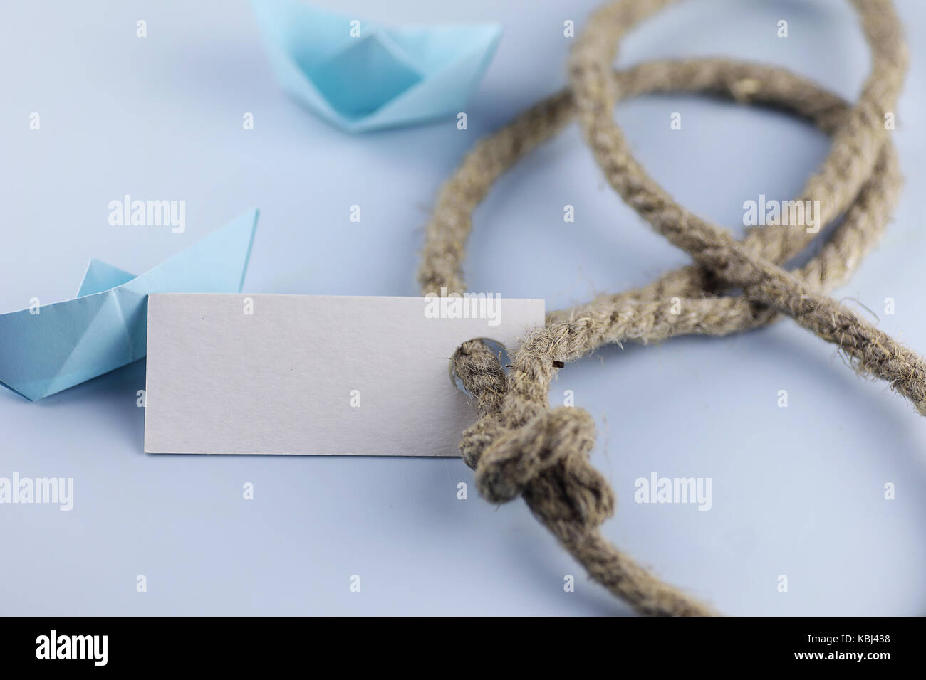 sticker with thick braided rope and ship paper origami Stock Photo - Alamy