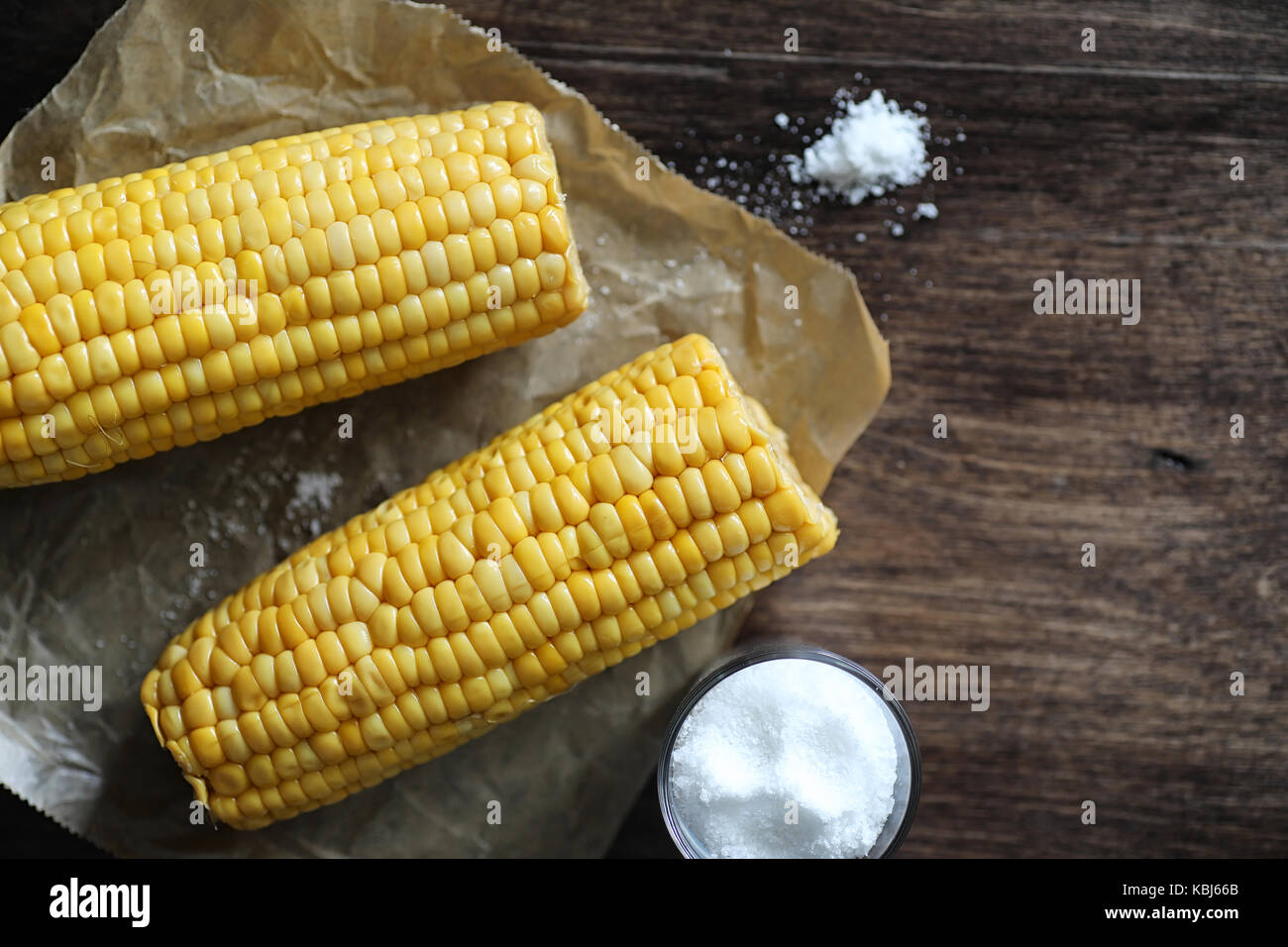 Boiled corn cob with salt on a wood Stock Photo - Alamy