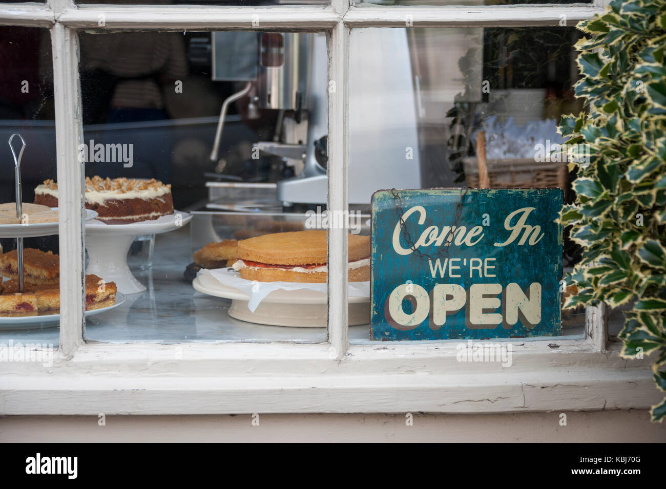 Home made cakes in a shop window, Lymington, Hampshire, UK Stock Photo ...