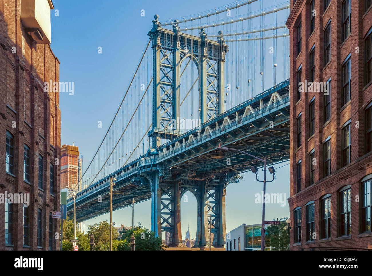 Empire State building through the Manhattan Bridge, NY - A warming view ...