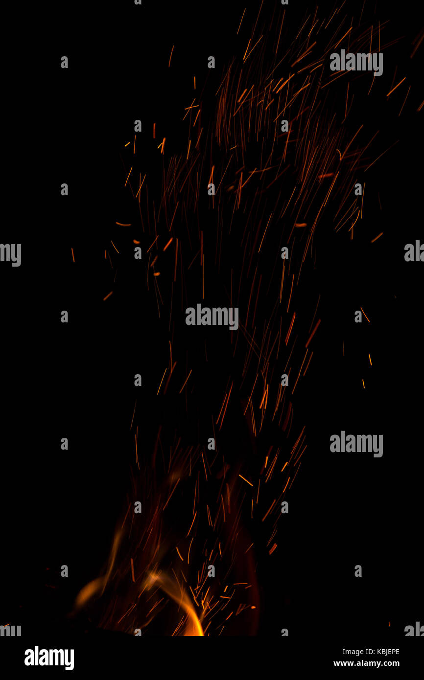 Photo of hot sparking live-coals burning, spark of bonfire Stock Photo ...