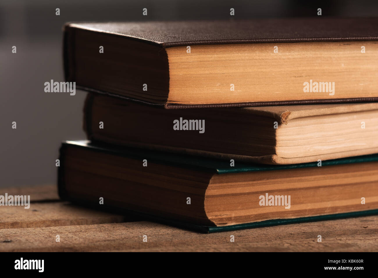 Old books on wooden table Stock Photo - Alamy