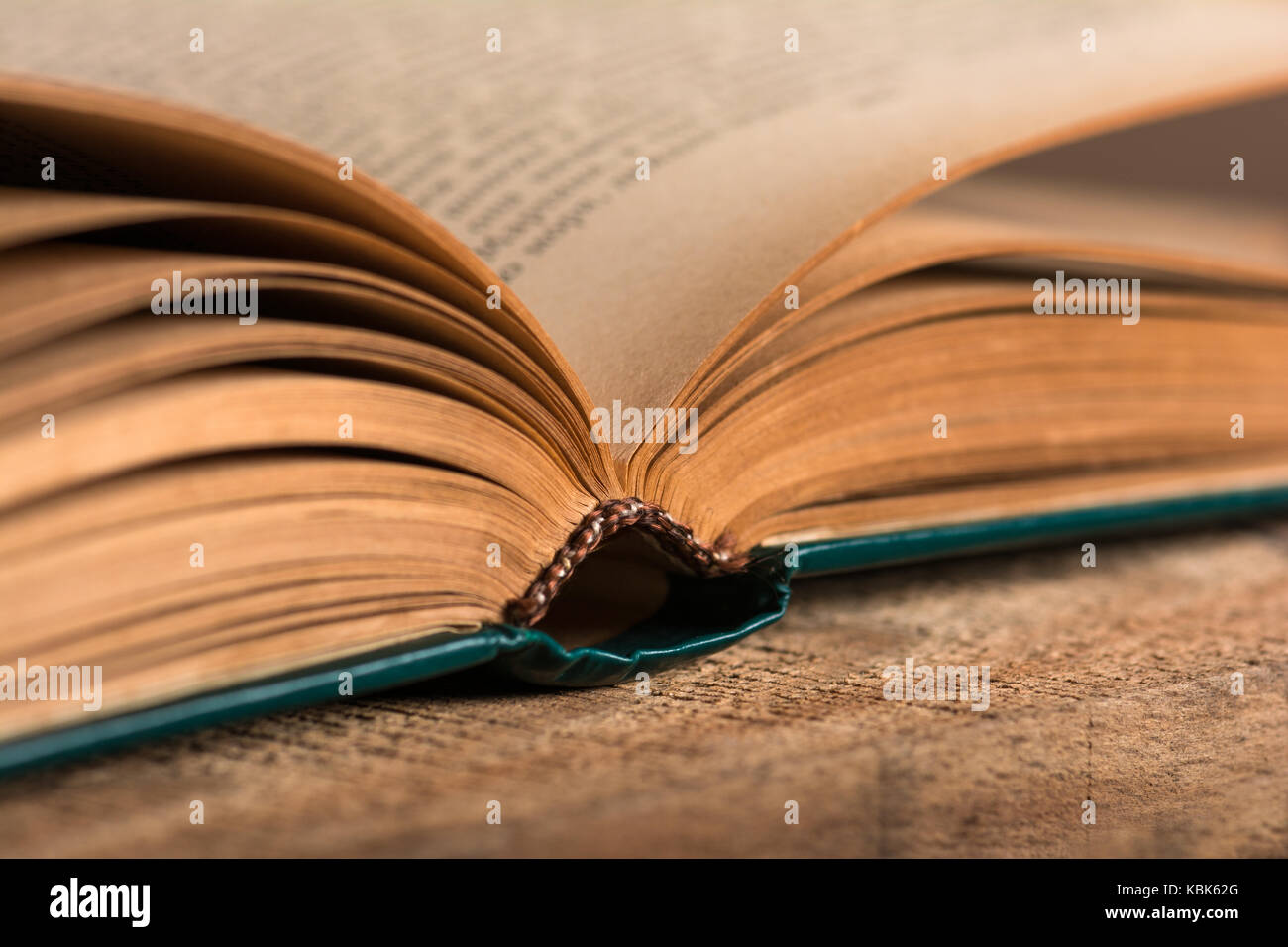 Open old book Stock Photo - Alamy
