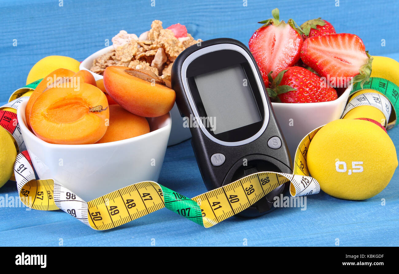 Glucose meter for measuring sugar level, healthy food, dumbbells for ...