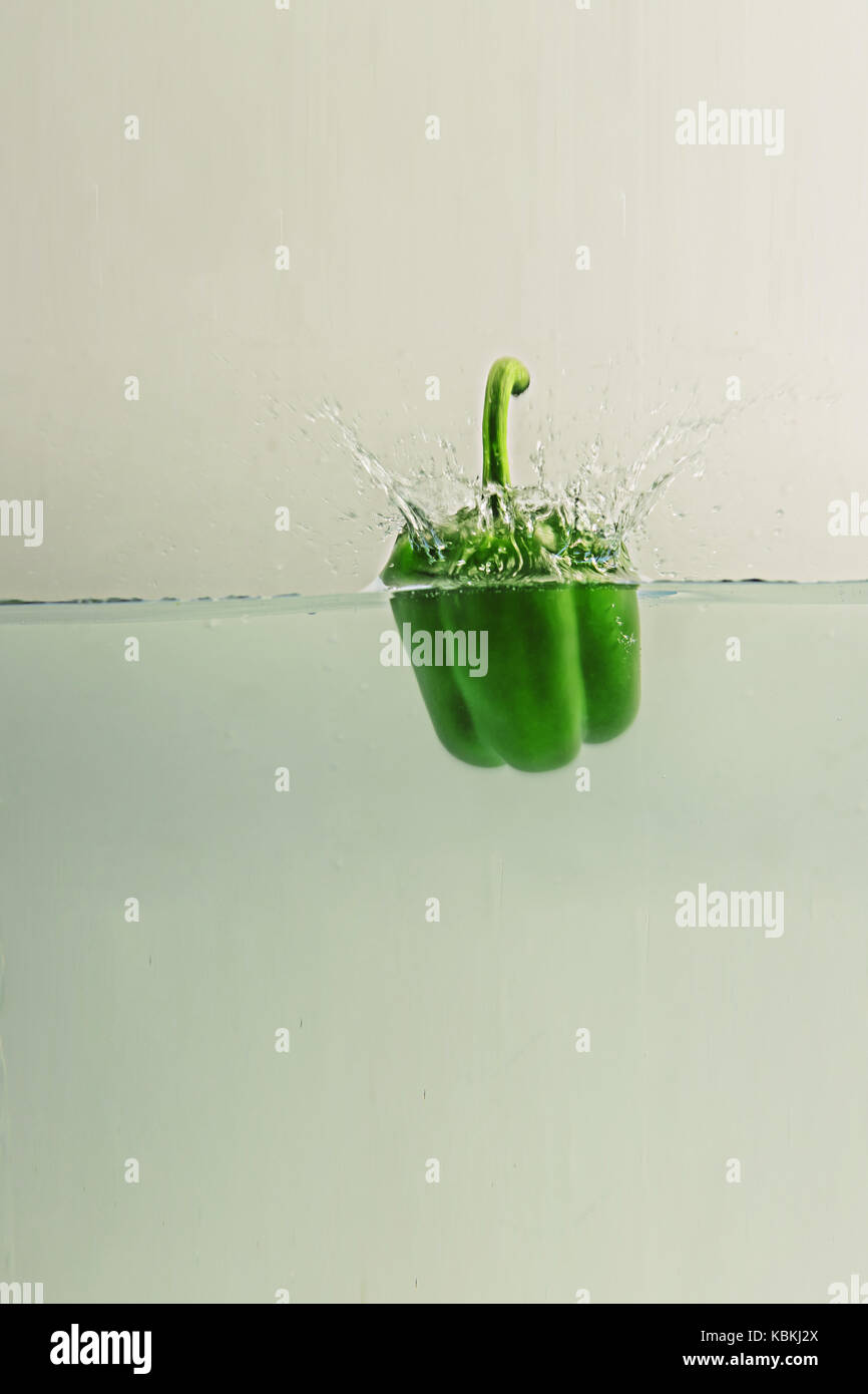 Bell pepper falls in water Stock Photo - Alamy