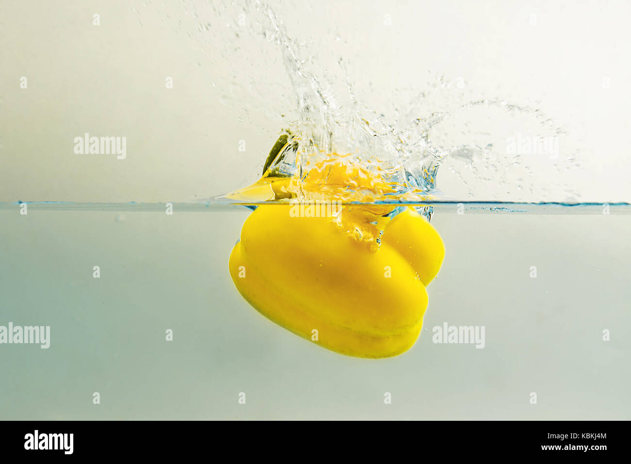 Bell pepper falls in water Stock Photo - Alamy
