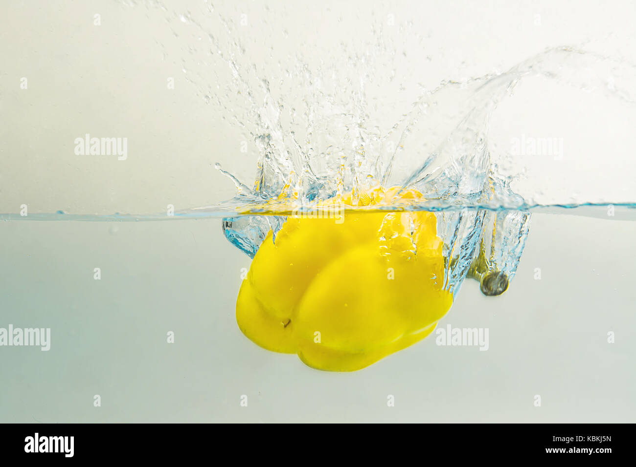 Bell pepper falls in water Stock Photo - Alamy