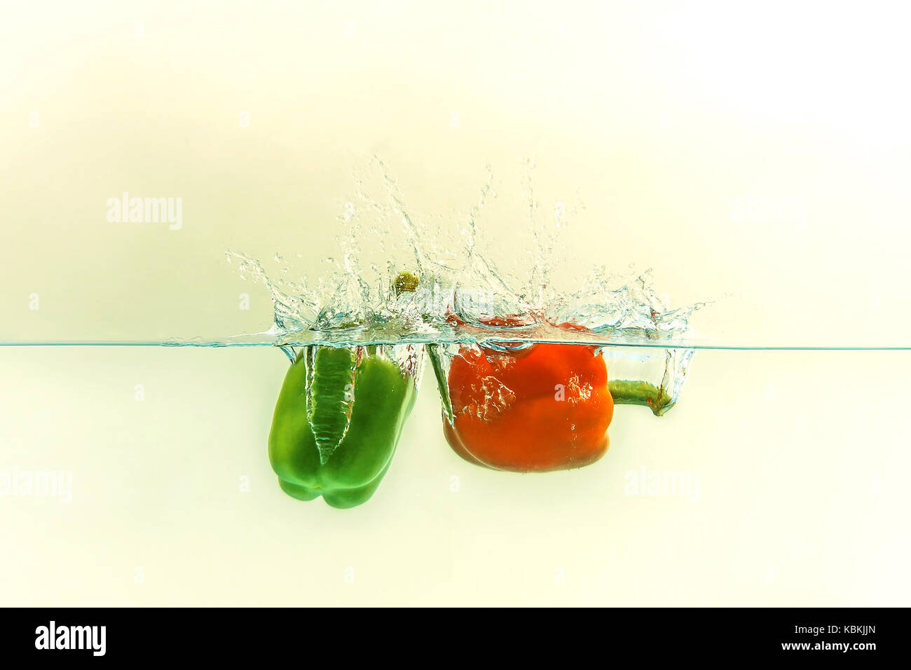 Bell pepper falls in water Stock Photo - Alamy