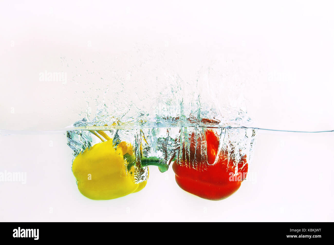 Bell pepper falls in water Stock Photo - Alamy