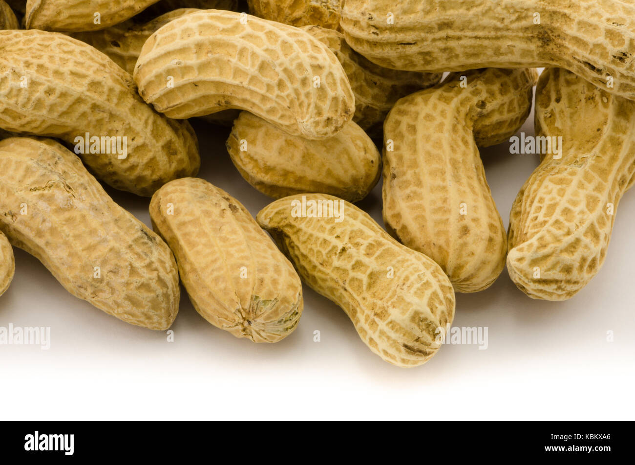 Macro closeup of Peanuts, isolated on white background Stock Photo - Alamy