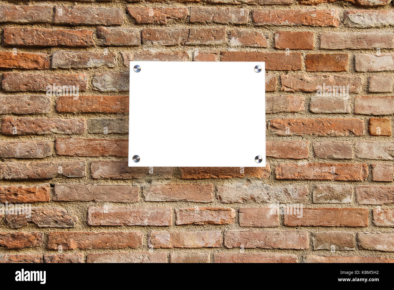 Empty information sign on old brick wall. White color Stock Photo - Alamy
