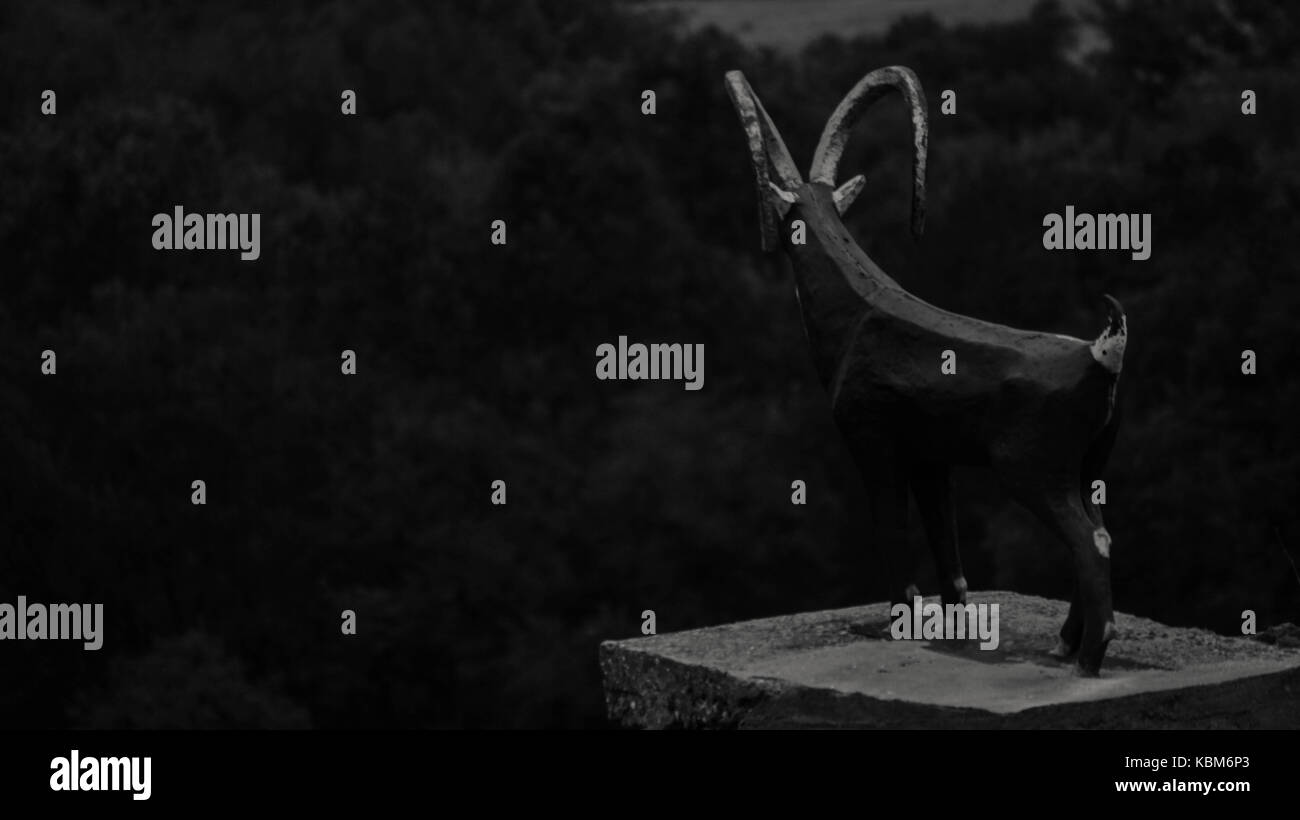 Iron goat on a hill Stock Photo - Alamy
