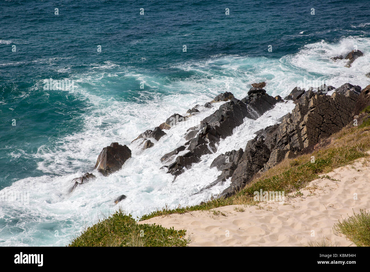 Rugged coastline at the northern end of One mile beach, Forster, mid ...