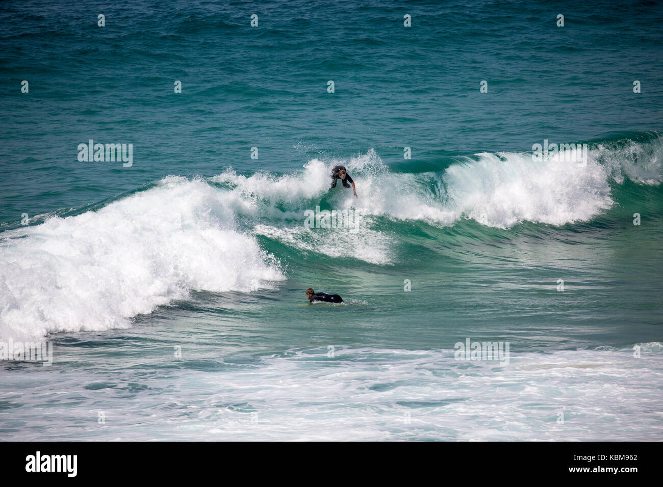 Man surfing in the ocean at One Mile beach in Forster on the new south ...