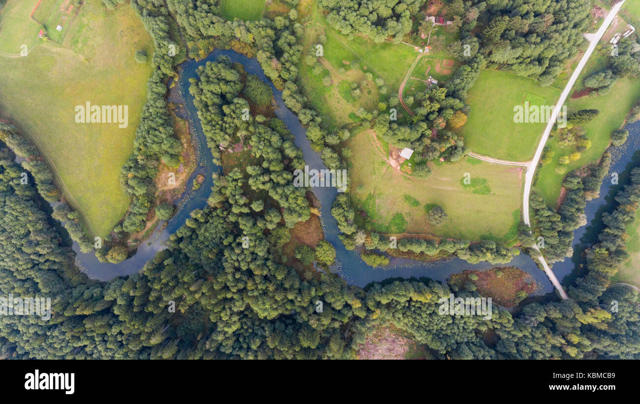Aerial view of river bend through forest Stock Photo - Alamy
